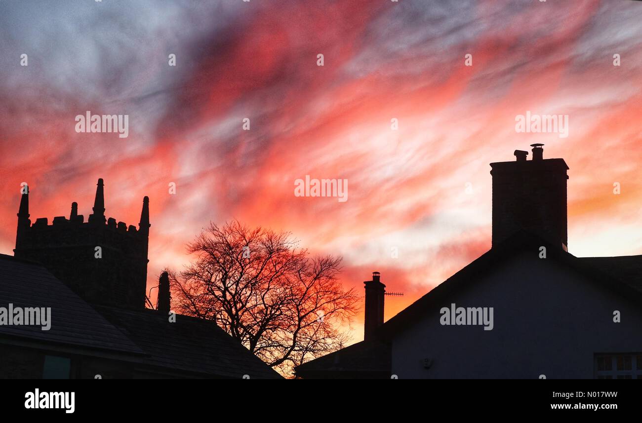UK Weather: Fire sky sunset over rooftops in Doddiscombsleigh, Devon ...