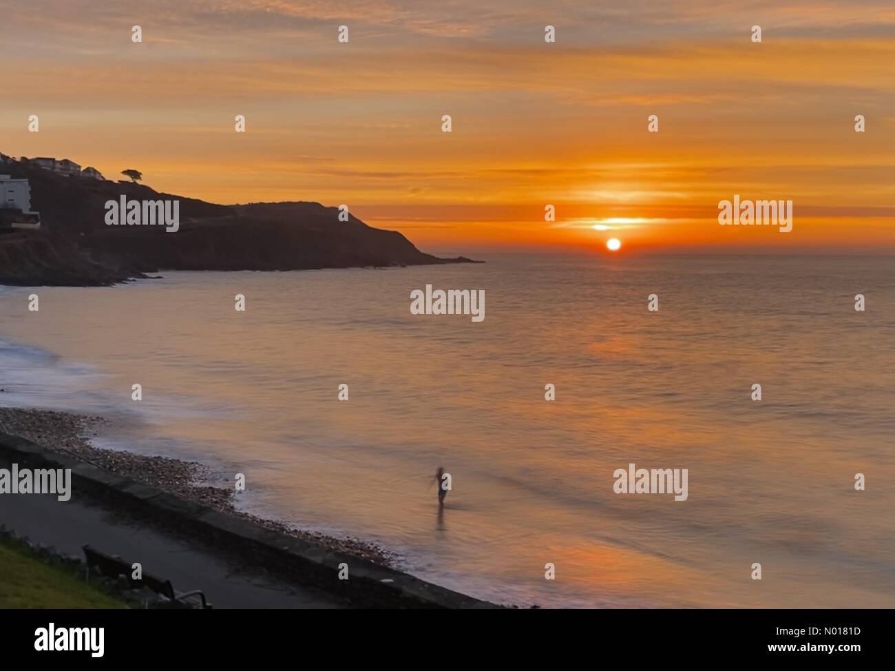 Langland Bay near Swansea, Wales, UK. 23 January, 2023. A swimmer ...