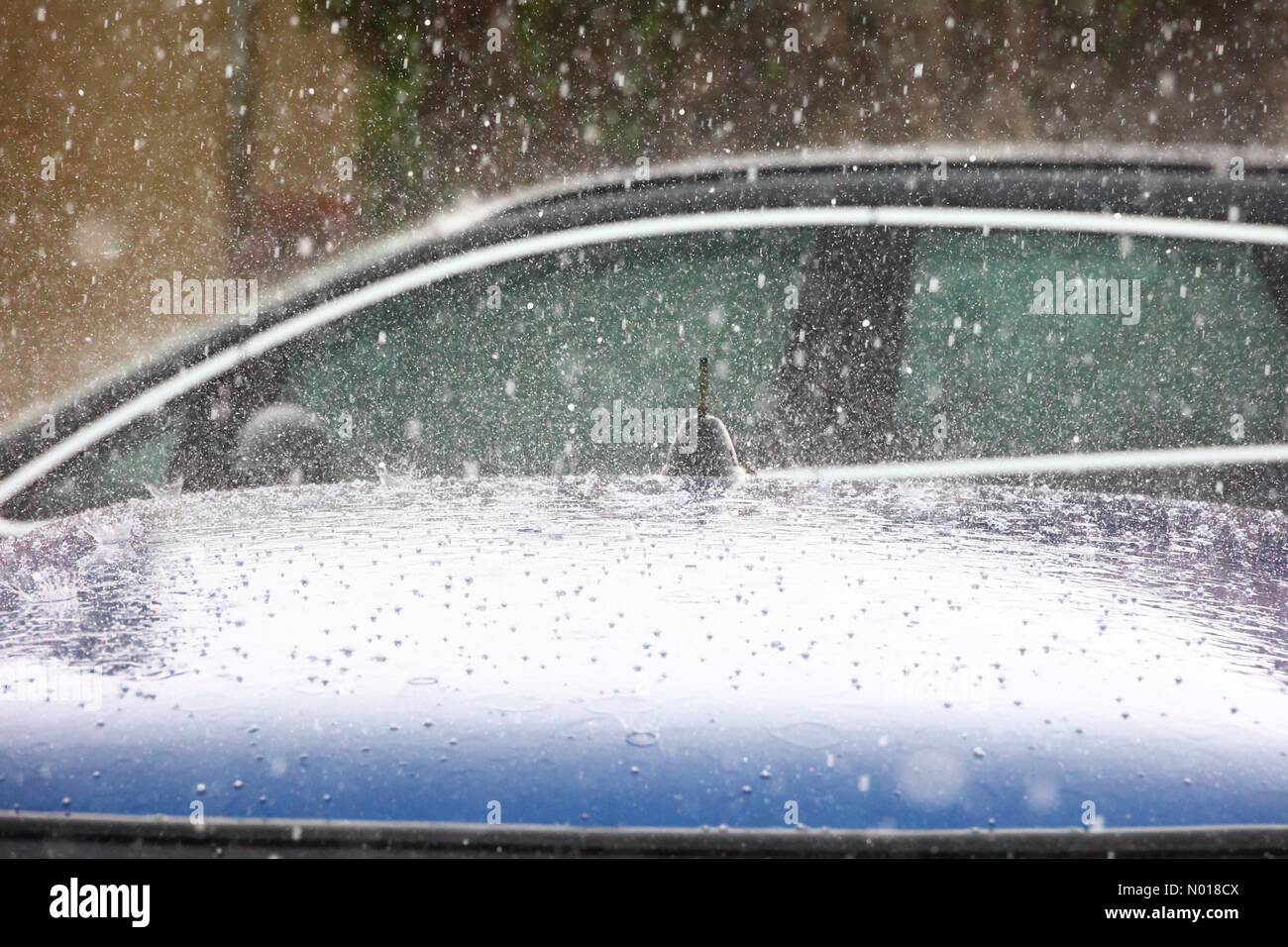 UK Weather: Freak thunder storm brings rain and hail splashing down on ...