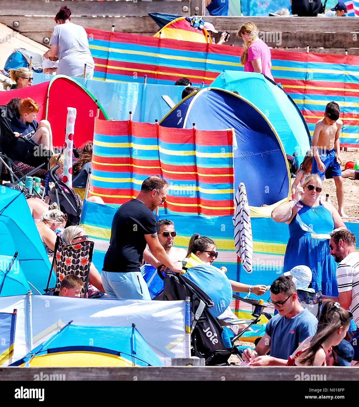 UK Weather: Crowds enjoy sun, sea and sand at Dawlish Warren beach ...