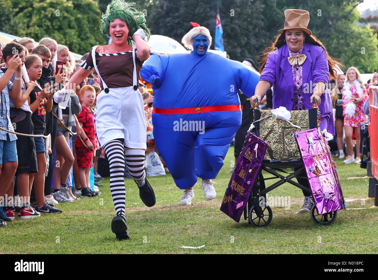 Crowds enjoy Dawlish Carnival 50th annual fancy dress pram race ...