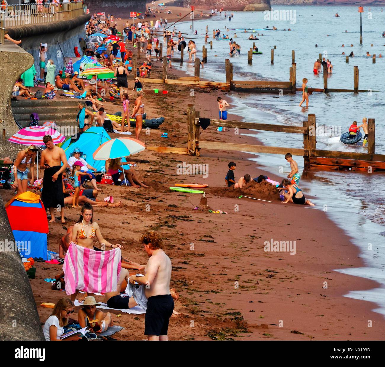 UK Weather: Packed beach at high tide during Teignmouth Sea Shanty ...