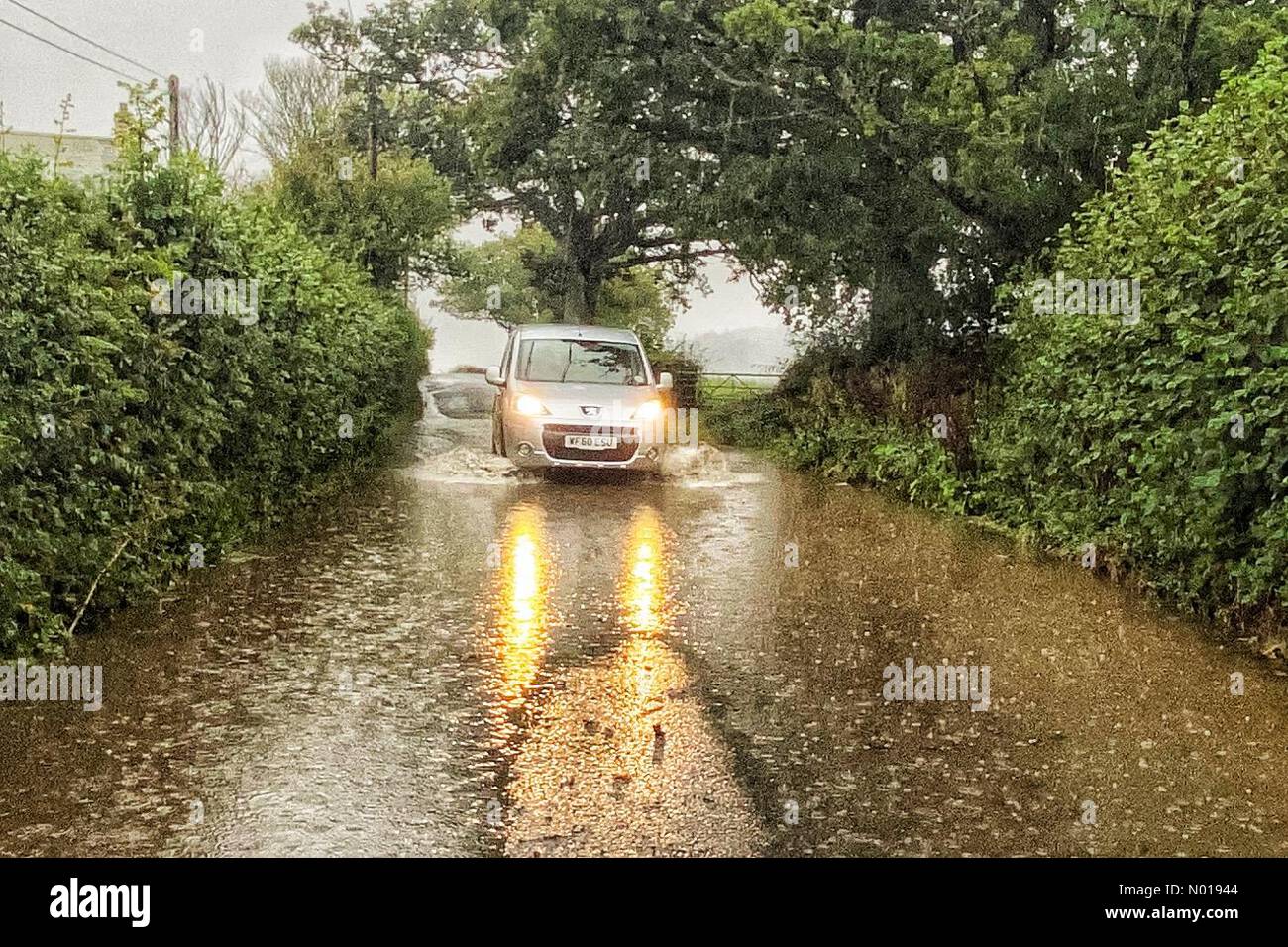 UK Weather; Torrential rain flash floods near Tedburn St Mary, Devon ...