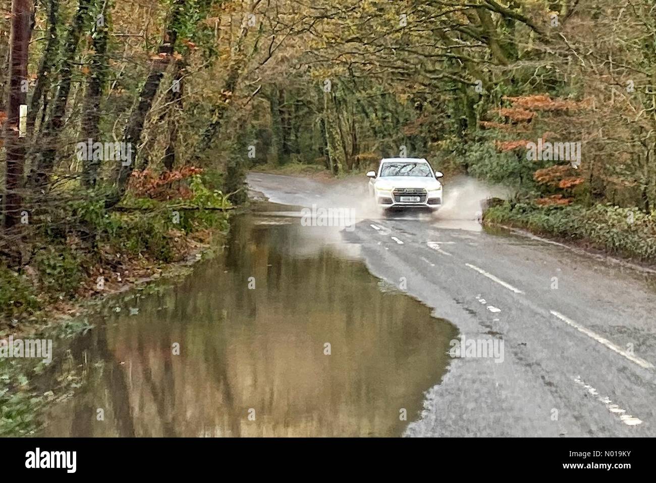 UK Weather: Car creates splash driving through big puddles in Haldon ...