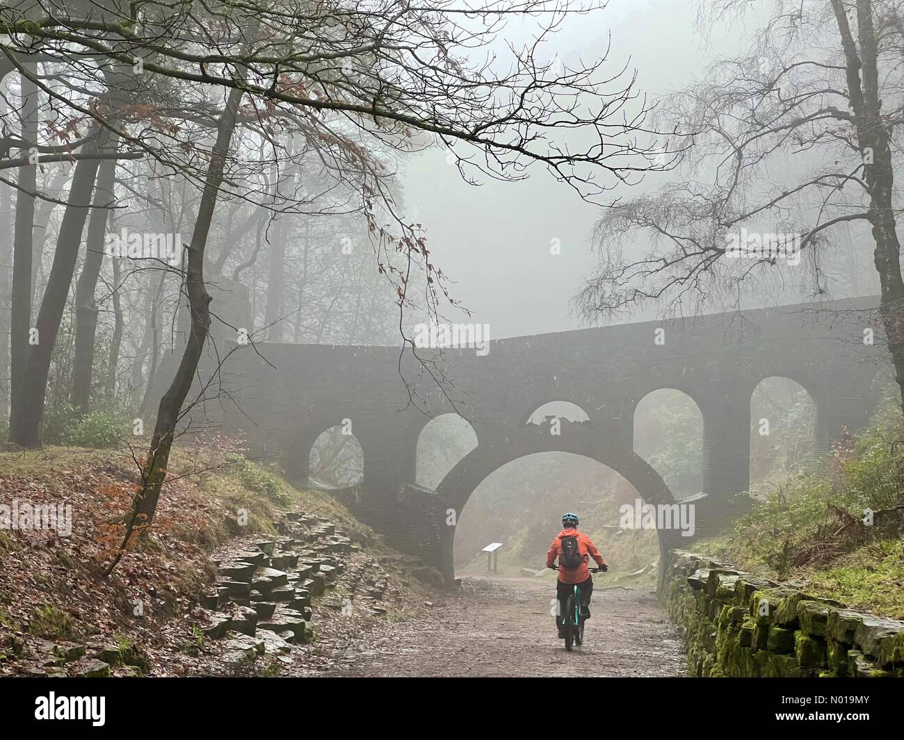UK Weather: Damp and misty at Rivington. Cyclist passing under Lever ...