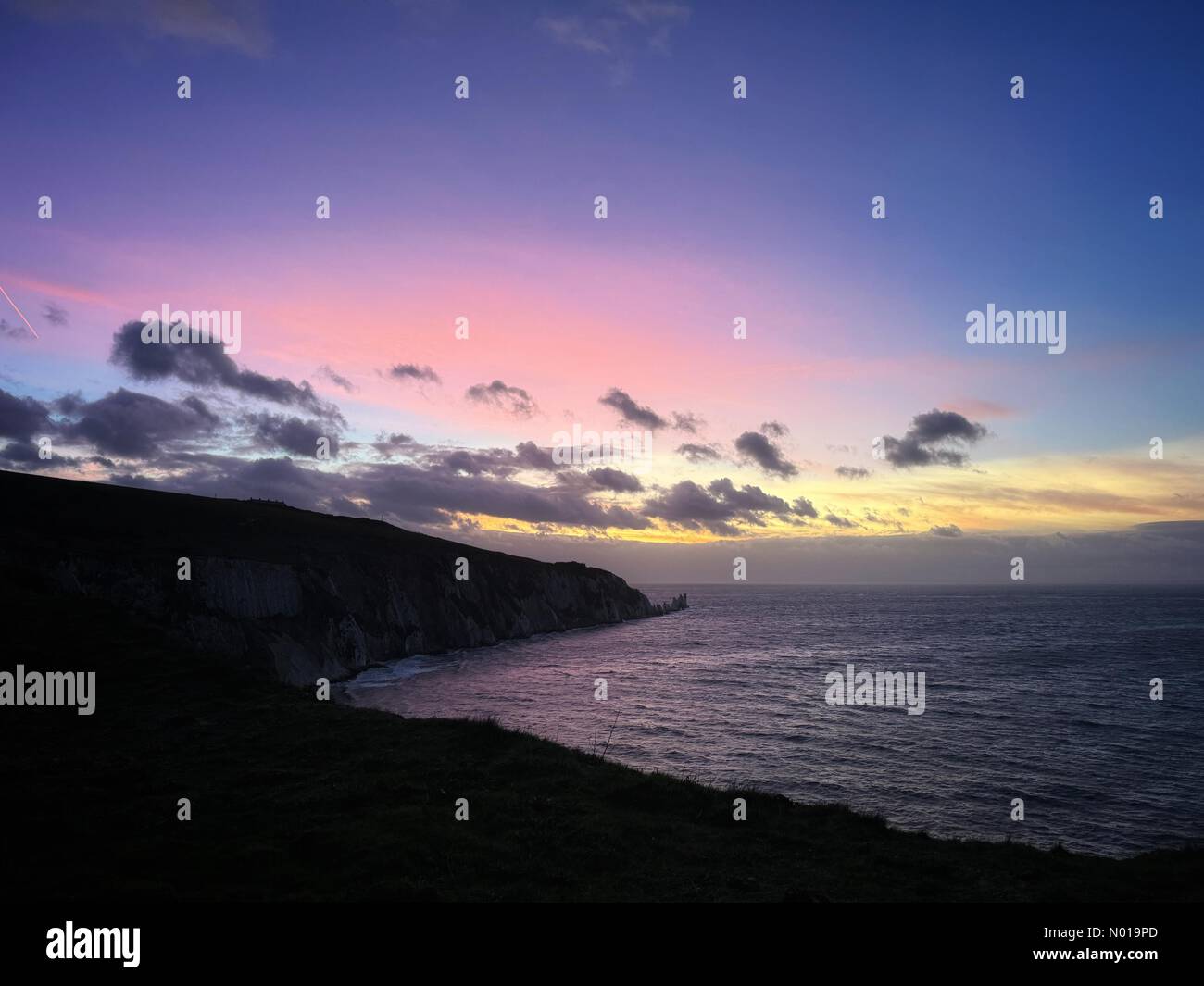 UK Weather: Sunset on the Isle of Wight. The Needles, Isle of Wight ...