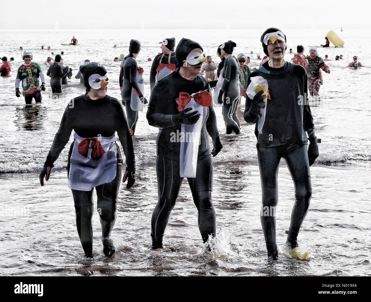 Colourful crowds and swimmers enjoy Boxing Day dip at Teignmouth, Devon ...