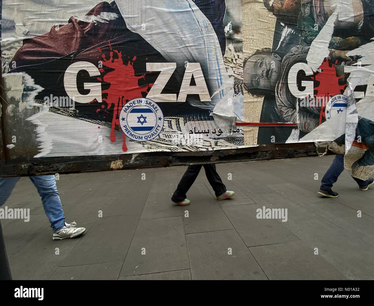 Rome Italy. 3 January 2024. People walk past a blood spattered poster ...