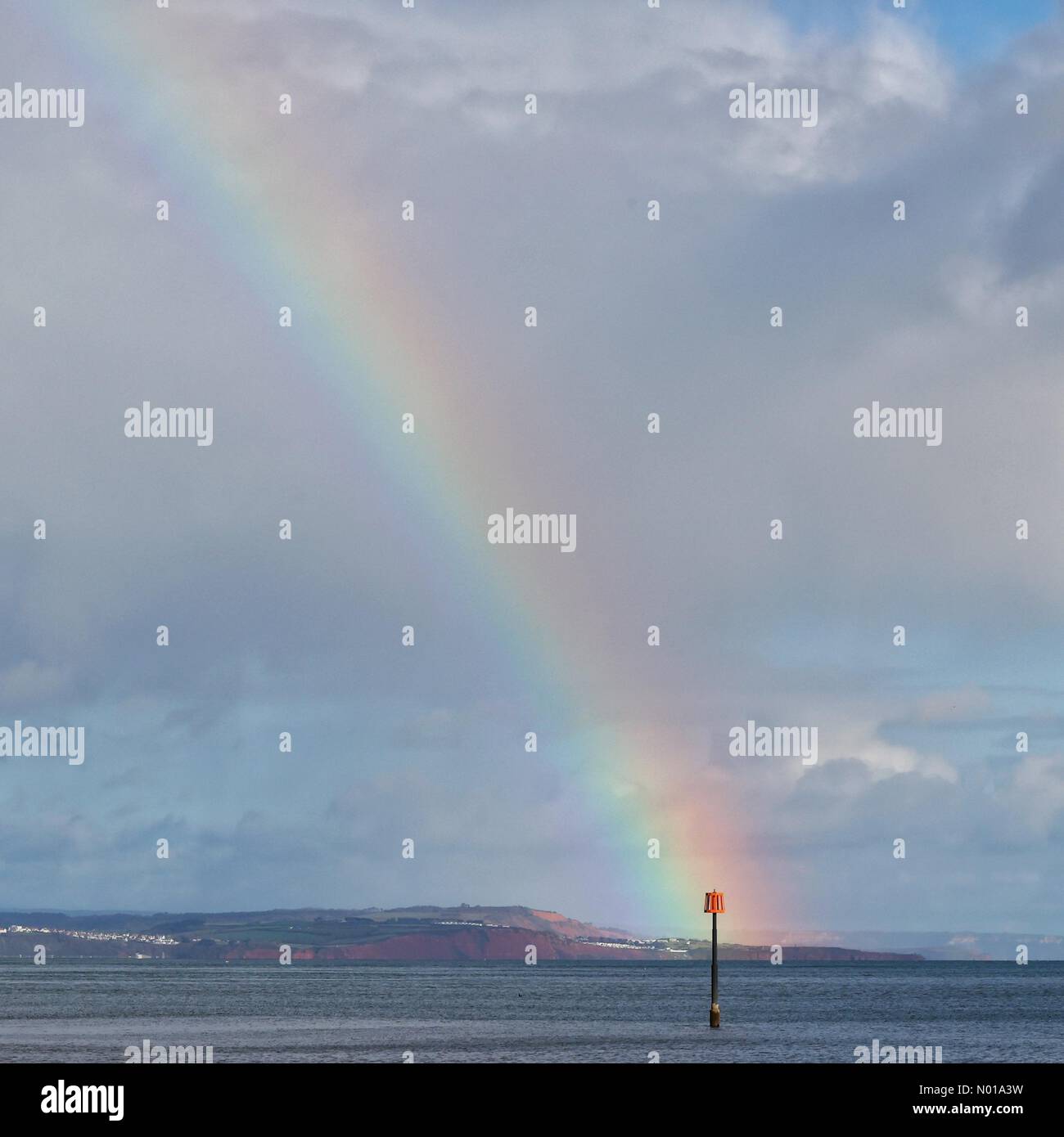 UK Weather: Rainbow at Teignmouth beach, Devon, UK. 5 Jan, 2024. Credit nidpor Credit: nidpor ...
