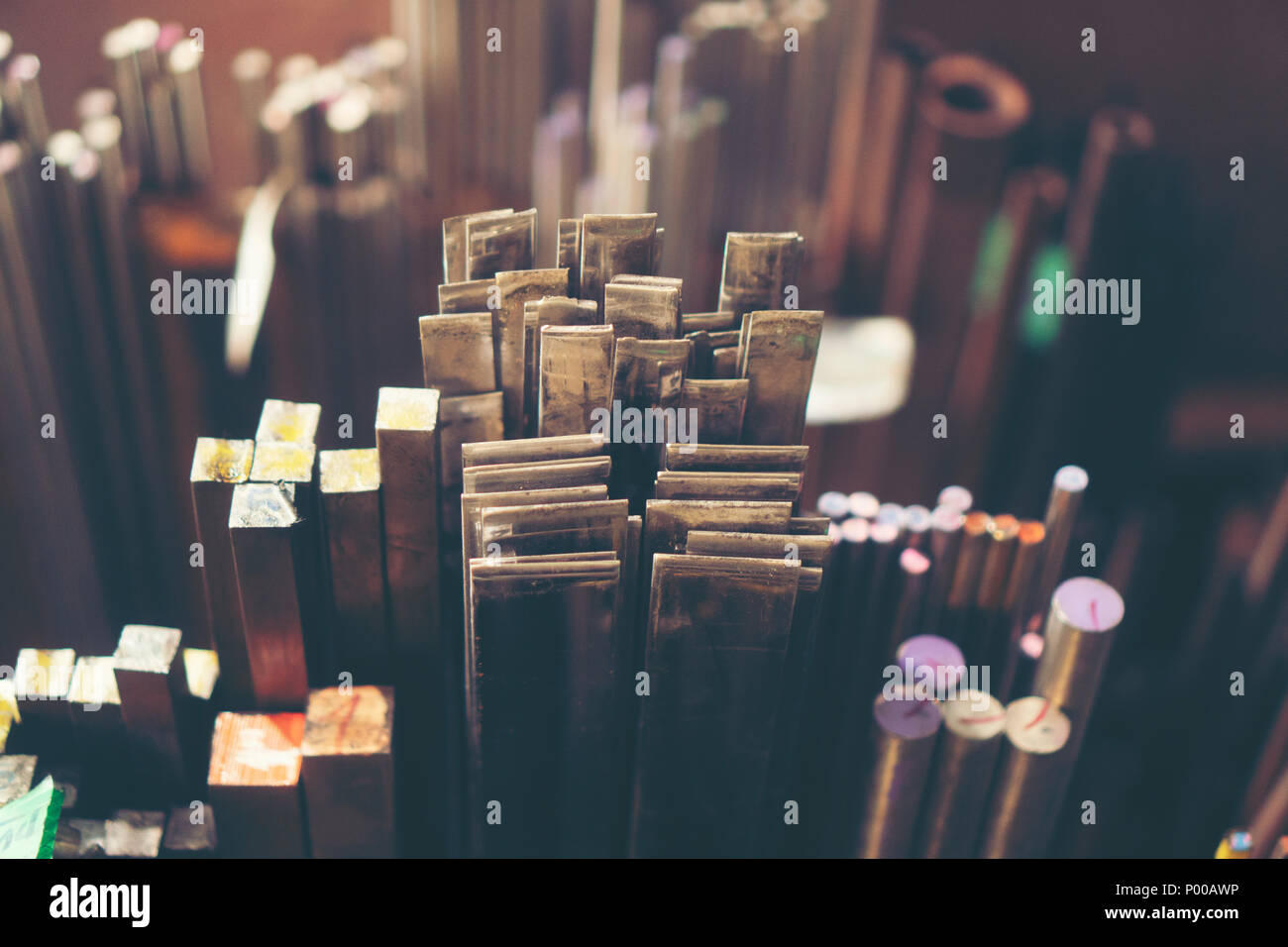 Stack of steel pipes in metal factory shop Stock Photo - Alamy