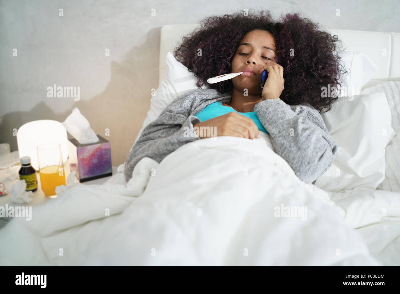 Teenager fever thermometer hi-res stock photography and images - Alamy