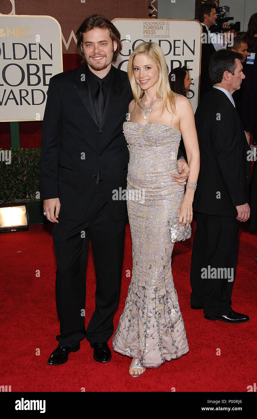 Chris Backus & Mira Sorvino at the Golden Globes Awards at the Beverly ...