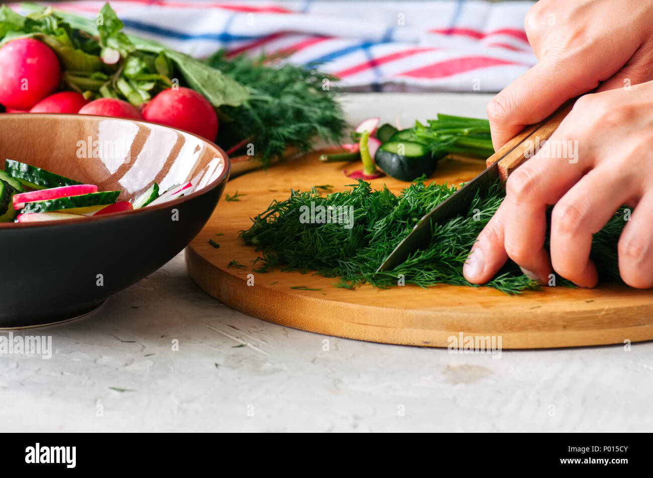 Womans hands cutting fresh dill hi-res stock photography and images - Alamy