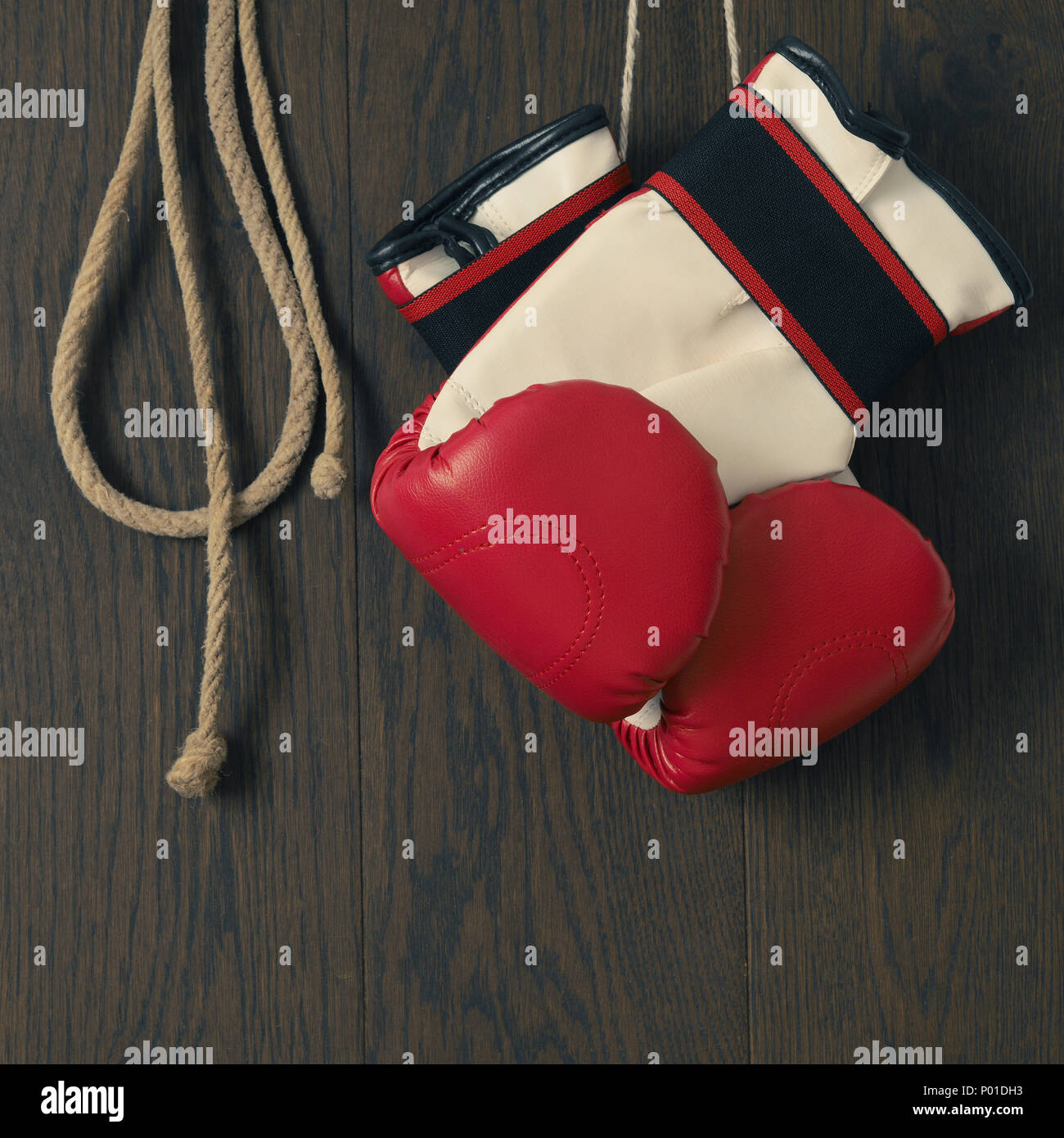 Red boxing gloves with a skipping rope on a wooden background Stock ...