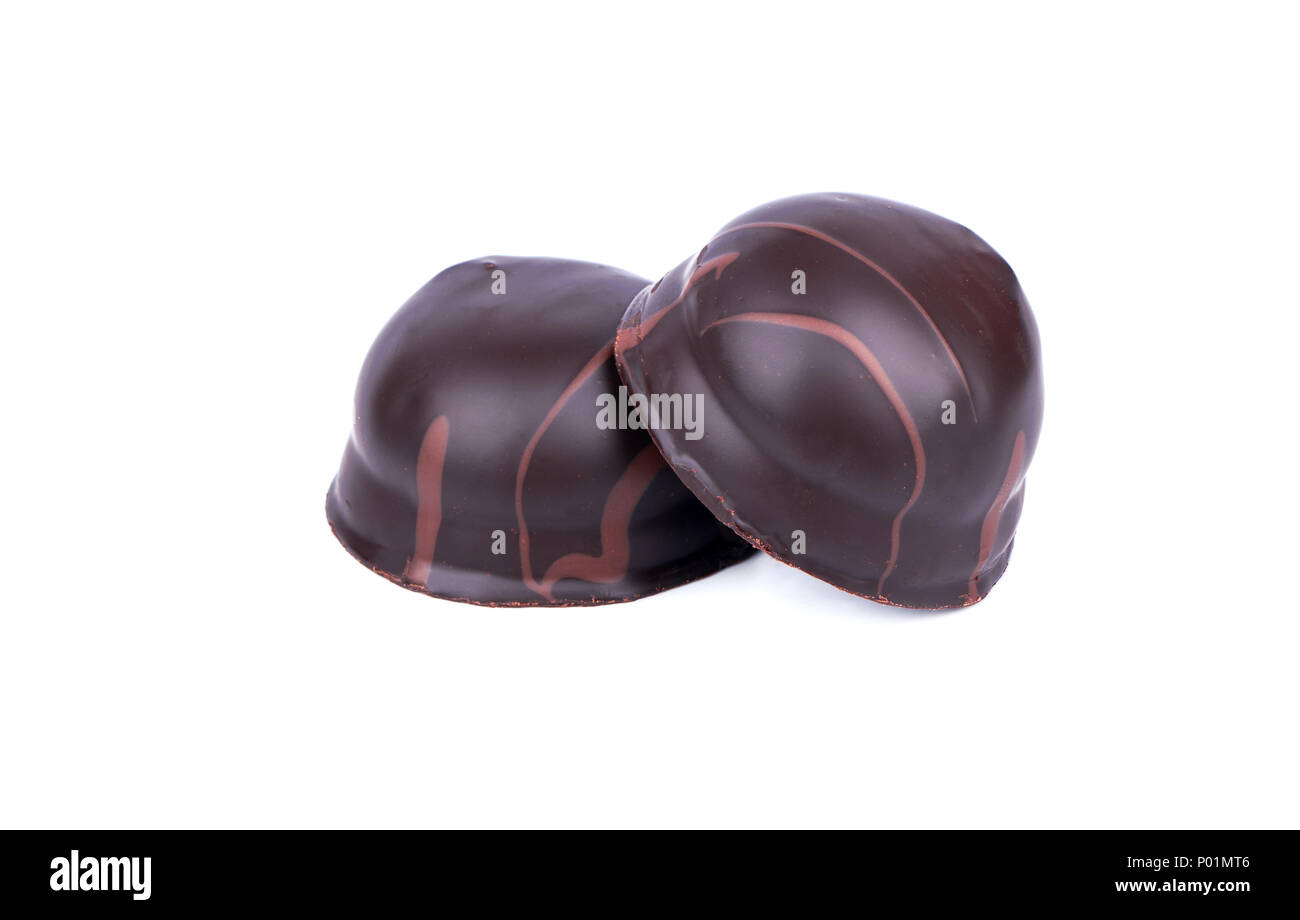 Two big chocolate candy with filling on white background Stock Photo ...