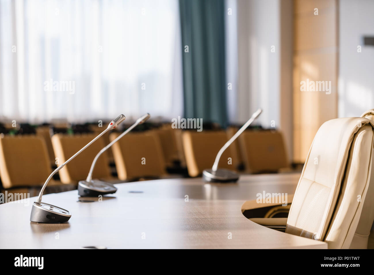 microphone in the foreground. Seminar presentation. Conference room ...