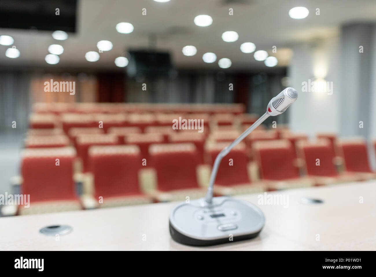 microphone in the foreground. Seminar presentation. Conference room ...