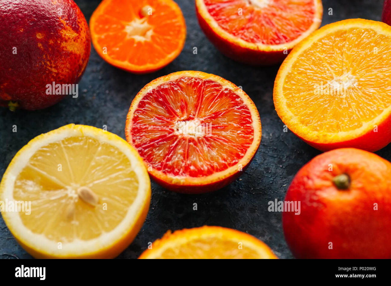 Mix of fresh ripe citrus fruits as blood oranges, mandarines, lemons on ...