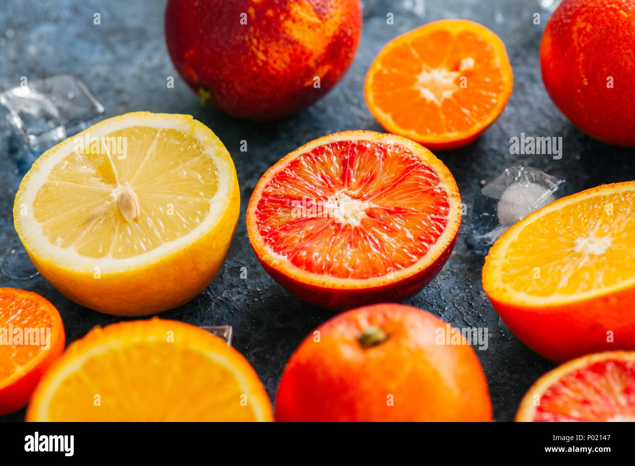 Mix of fresh ripe citrus fruits as blood oranges, mandarines, lemons ...