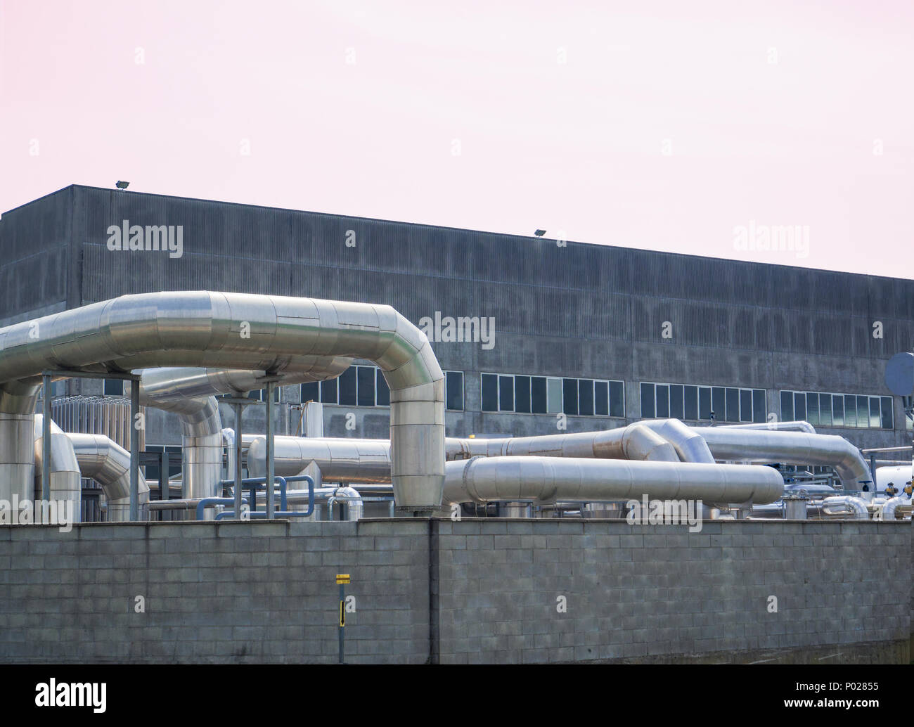 long pipes of a complicated plant of a chemical company Stock Photo - Alamy
