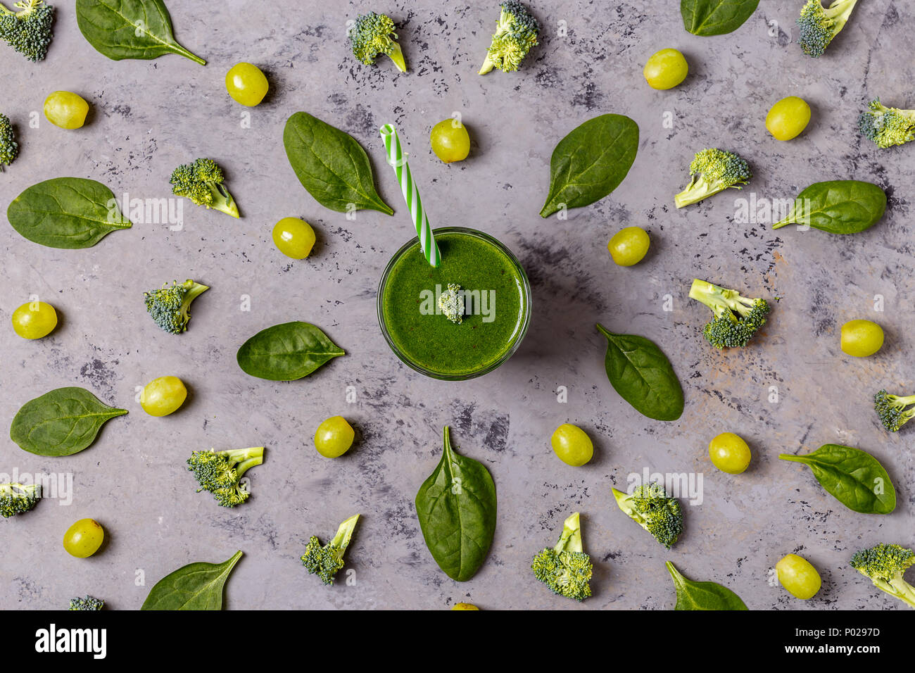 Green smoothie with ingredients on concrete surface, top view Stock ...