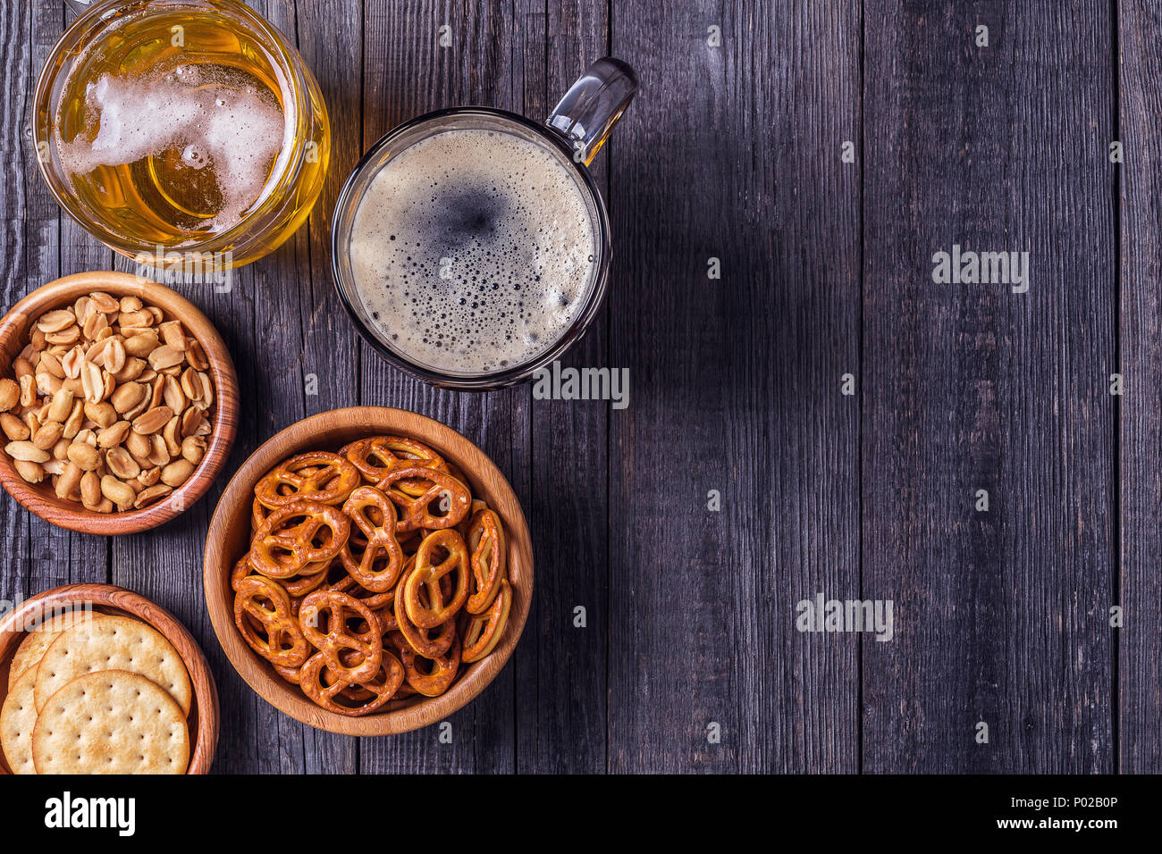 Beer with Pretzels, Crackers and Nuts, top view Stock Photo - Alamy