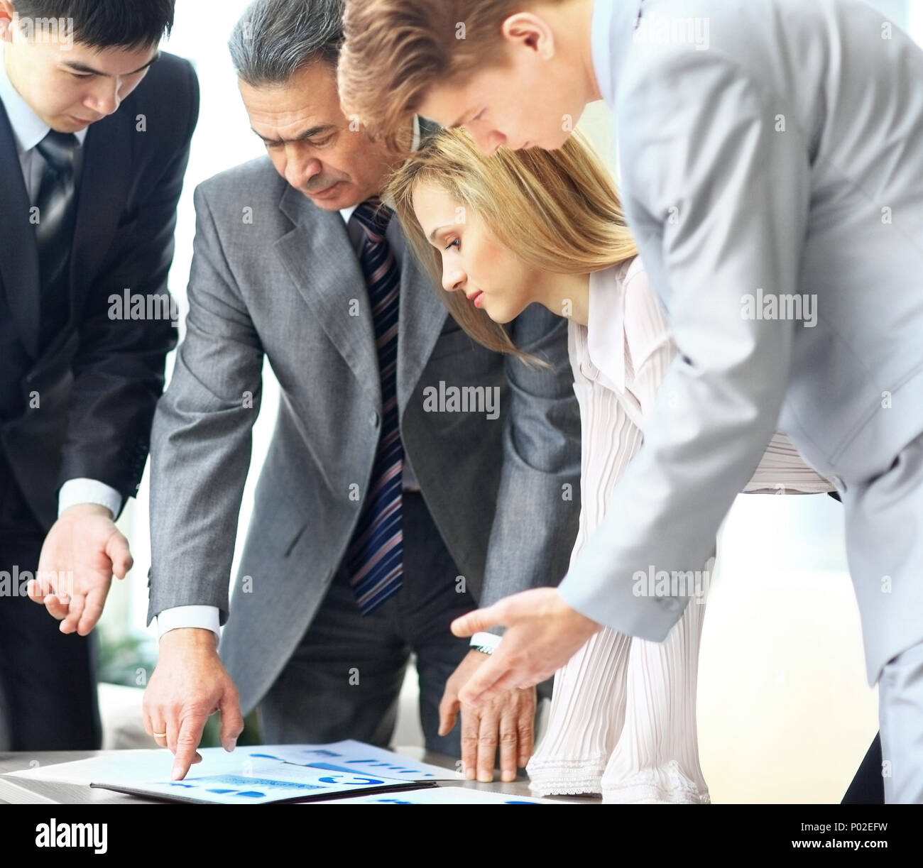 Business team working on their business project together Stock Photo ...
