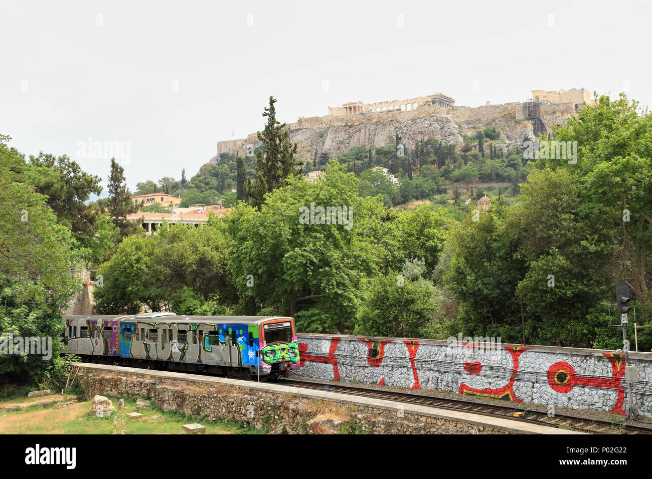 Athens Metro line in front of the Acropolis Stock Photo - Alamy