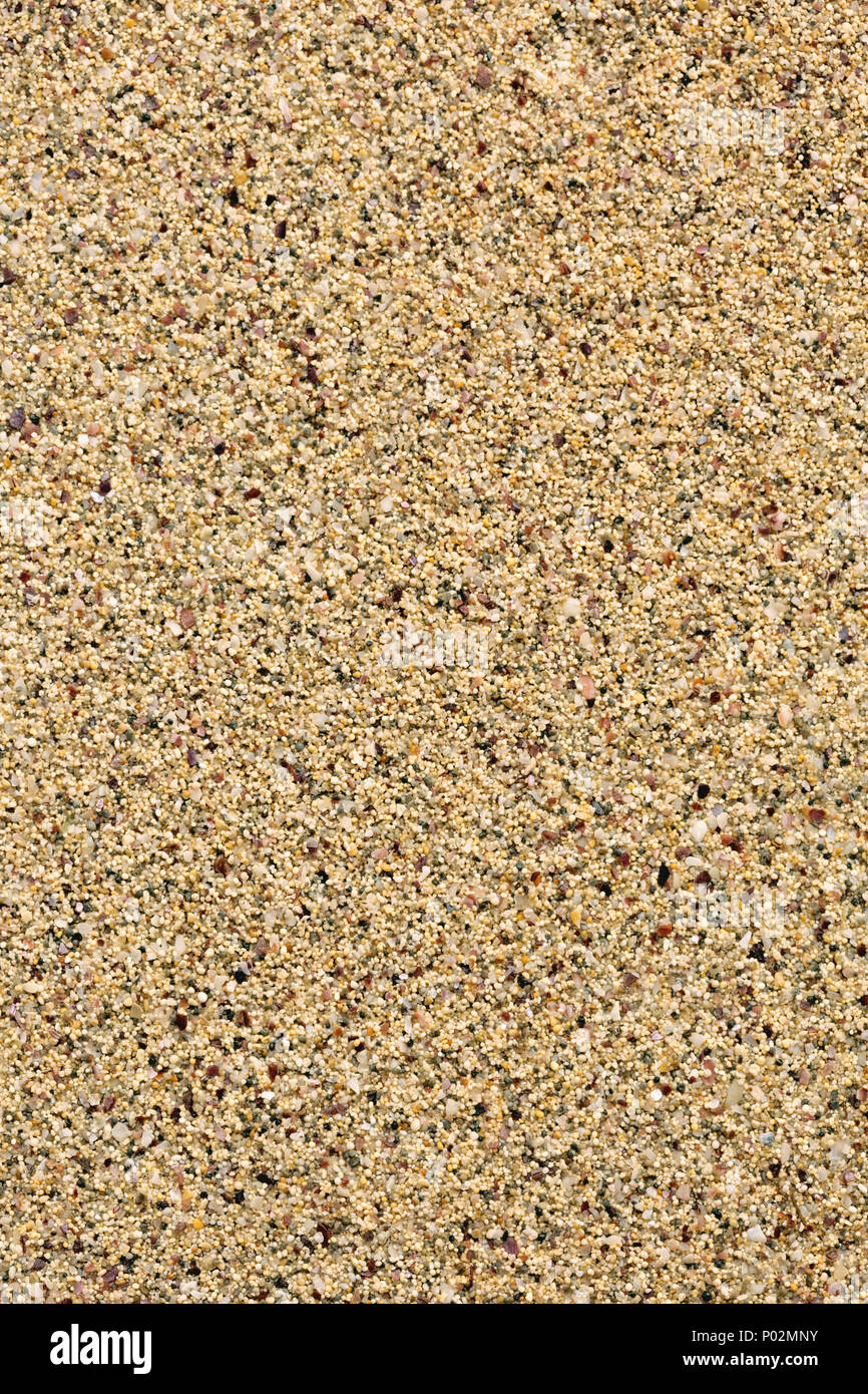 Sea sand, smooth background. Small pellets. Vertical Stock Photo - Alamy
