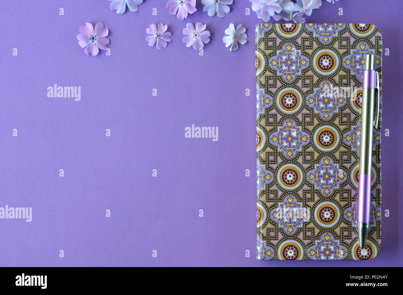 Ultra violet flatlay of feminine stationery, notebook, pen, lavender ...