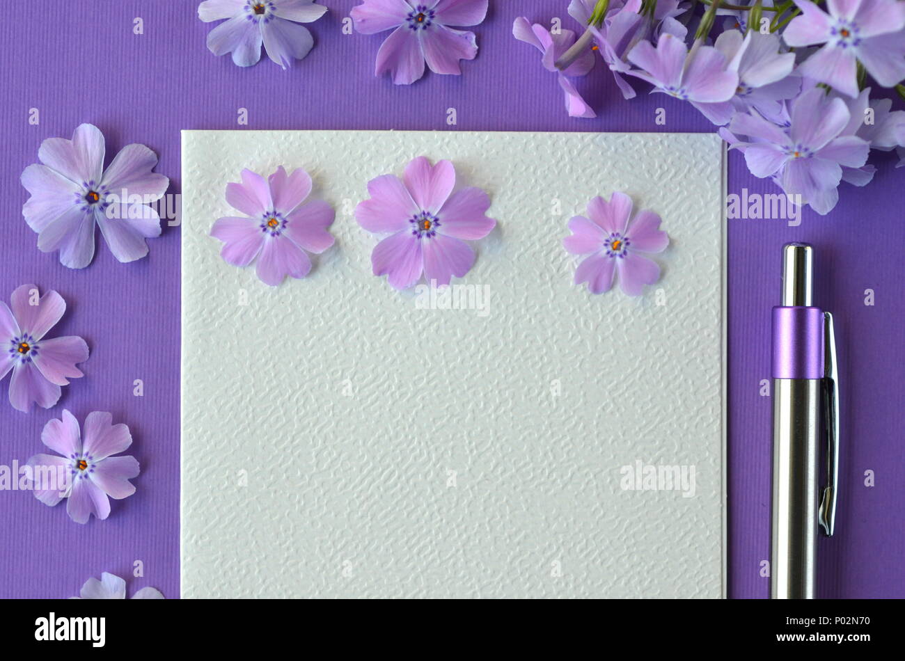 Ultra violet flatlay of feminine stationery, notebook, pen, lavender ...