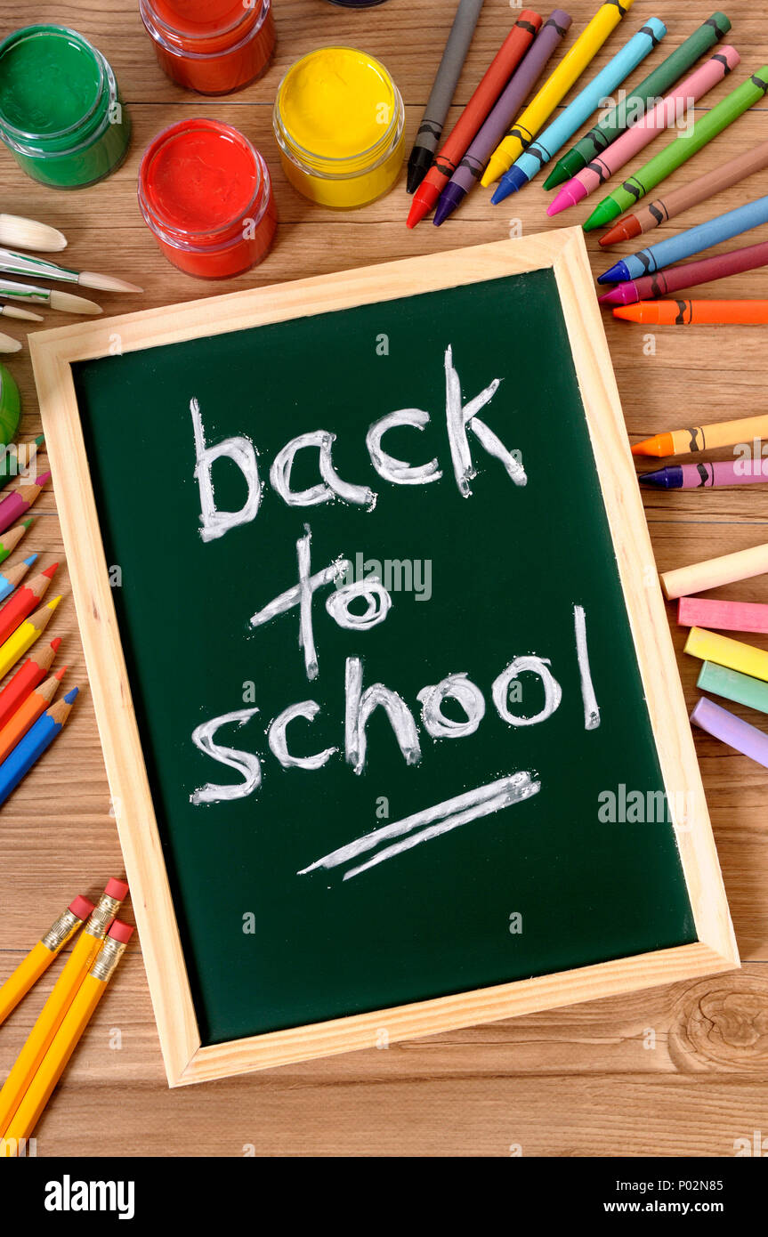 The words Back to School written on a small elementary blackboard with ...