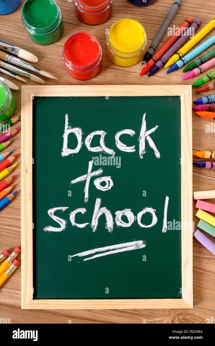 The words Back to School written on a small elementary blackboard with ...