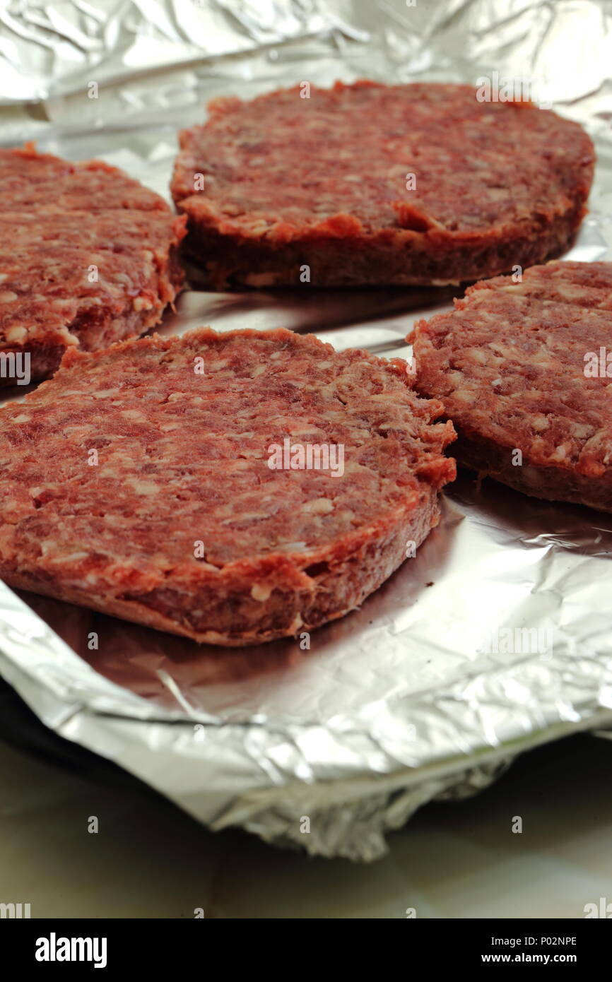Ready to cook beef burgers hi-res stock photography and images - Alamy