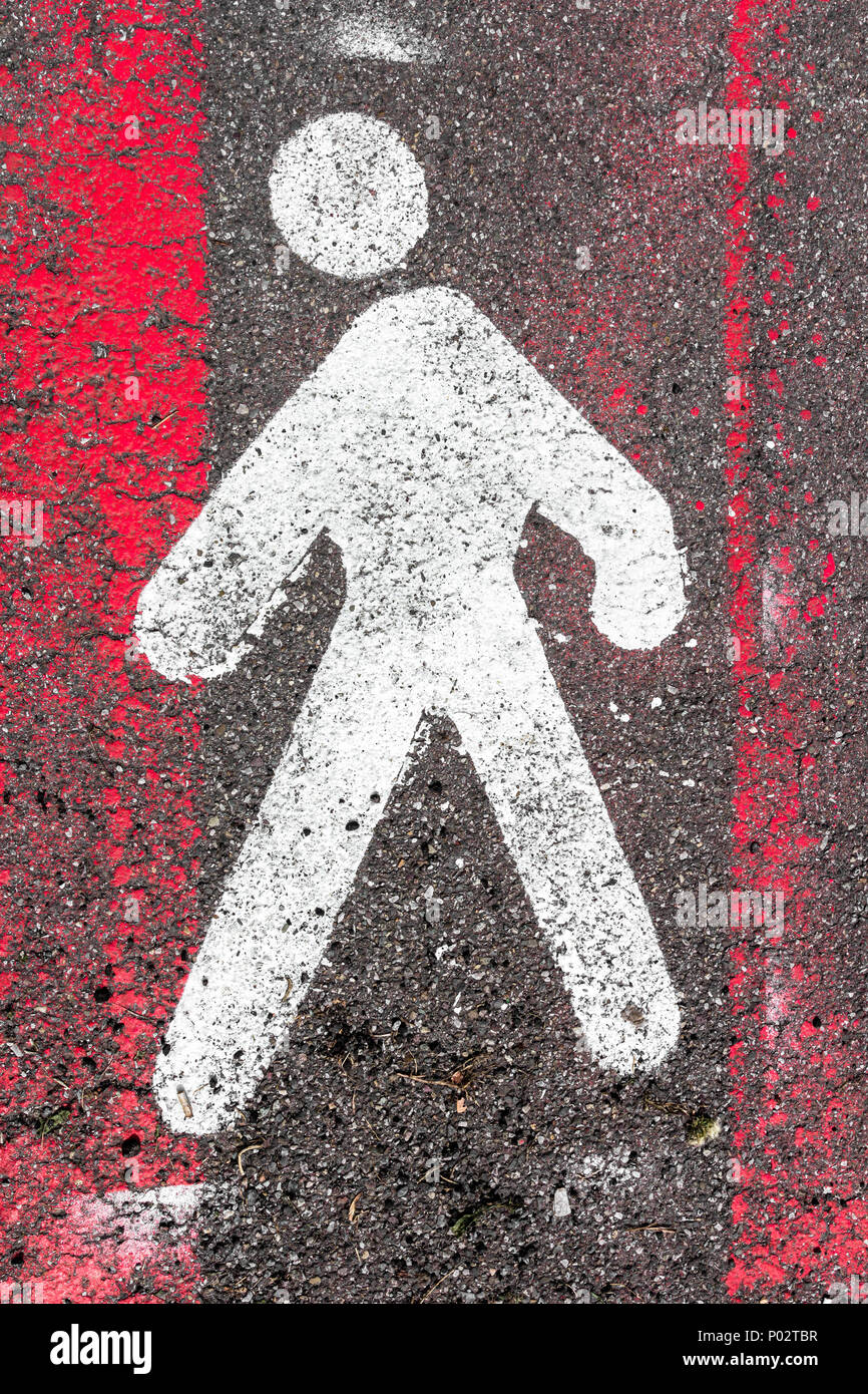 White pedestrian signal of person on asphalt, walkway pedestrian ...