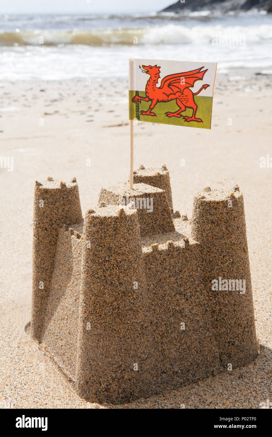 Sandcastle On Beach Flying Welsh Flag Stock Photo - Alamy