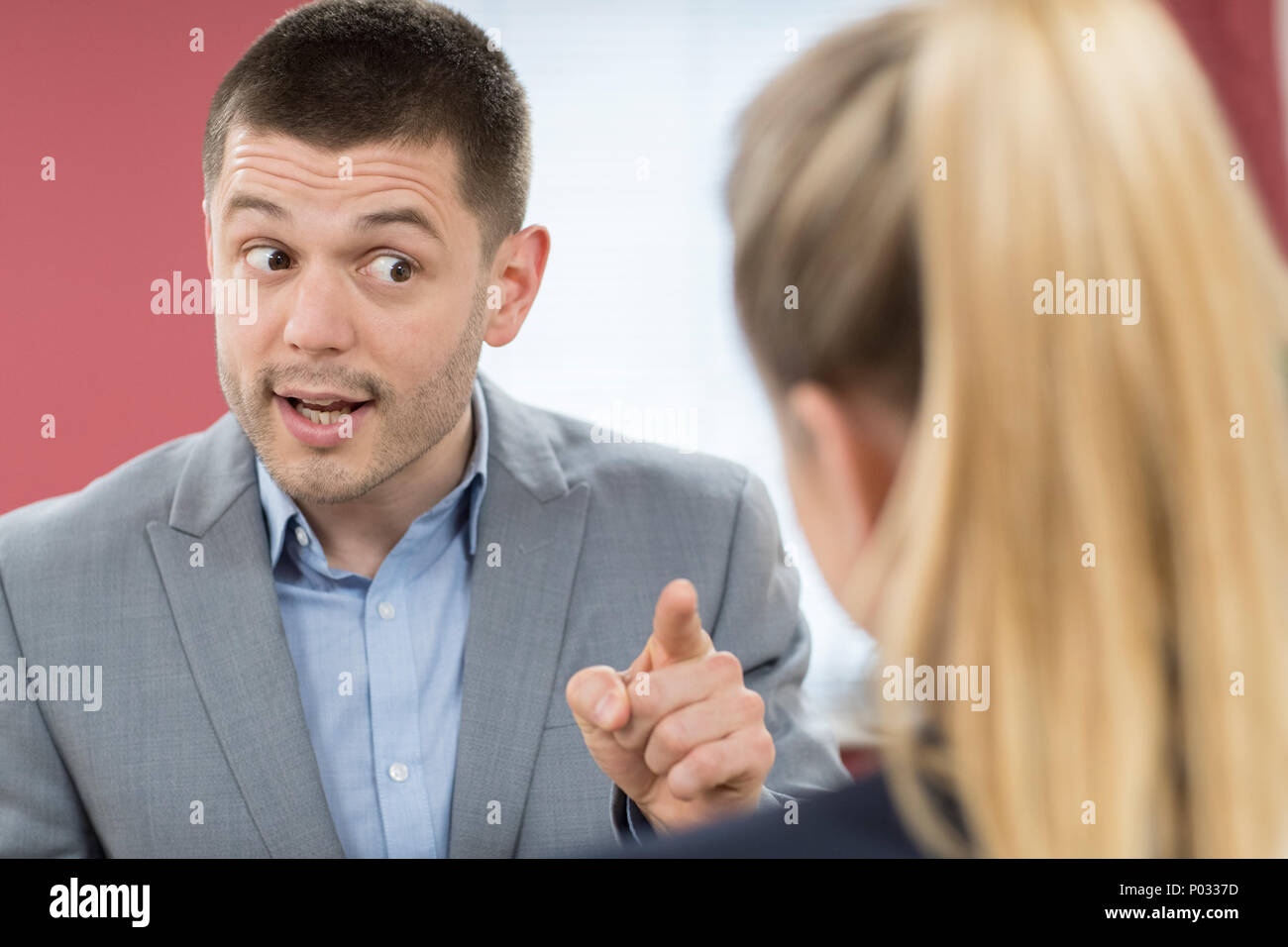 Aggressive Businessman Bullying Female Colleague In Office Stock Photo ...