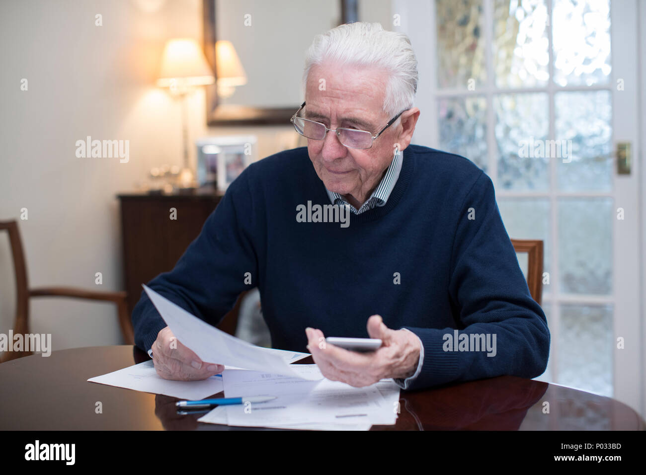 Concerned Senior Man Reviewing Domestic Finances Stock Photo - Alamy