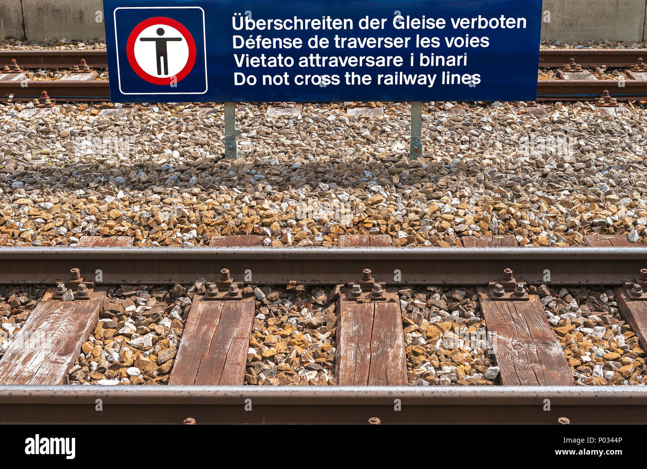 Warning signboard at the railroad Stock Photo - Alamy