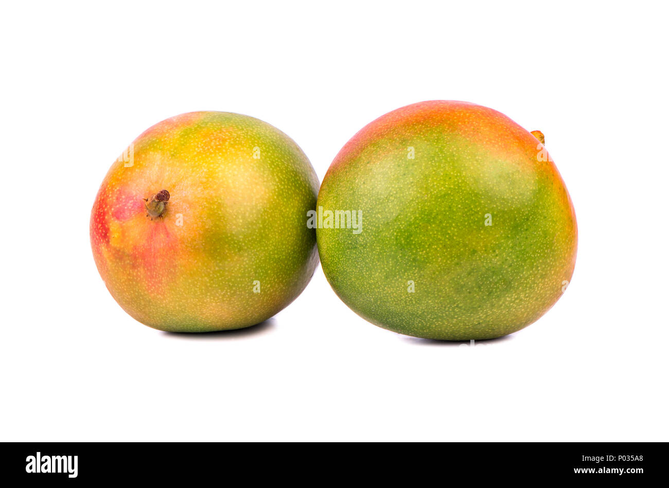 Two ripe mango tropical fruit isolated on white background Stock Photo ...