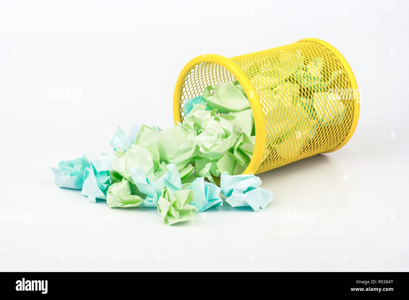Up spillage used crumpled paper from yellow iron basket Stock Photo - Alamy