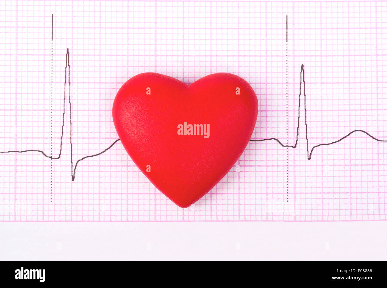 Red heart lying on the picture cardiogram Stock Photo - Alamy