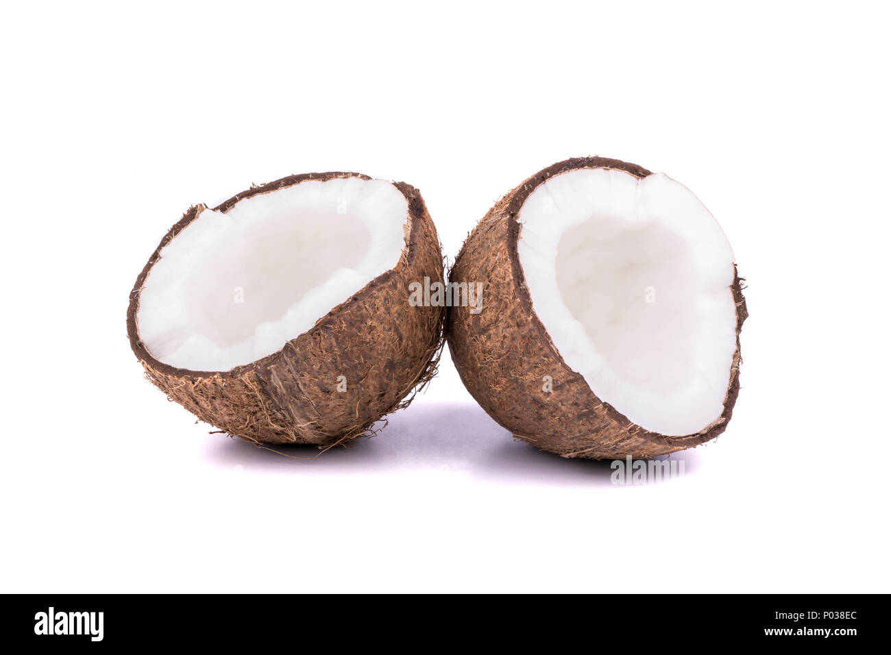 Ripe fruit coconut split into two halves on a white background Stock ...