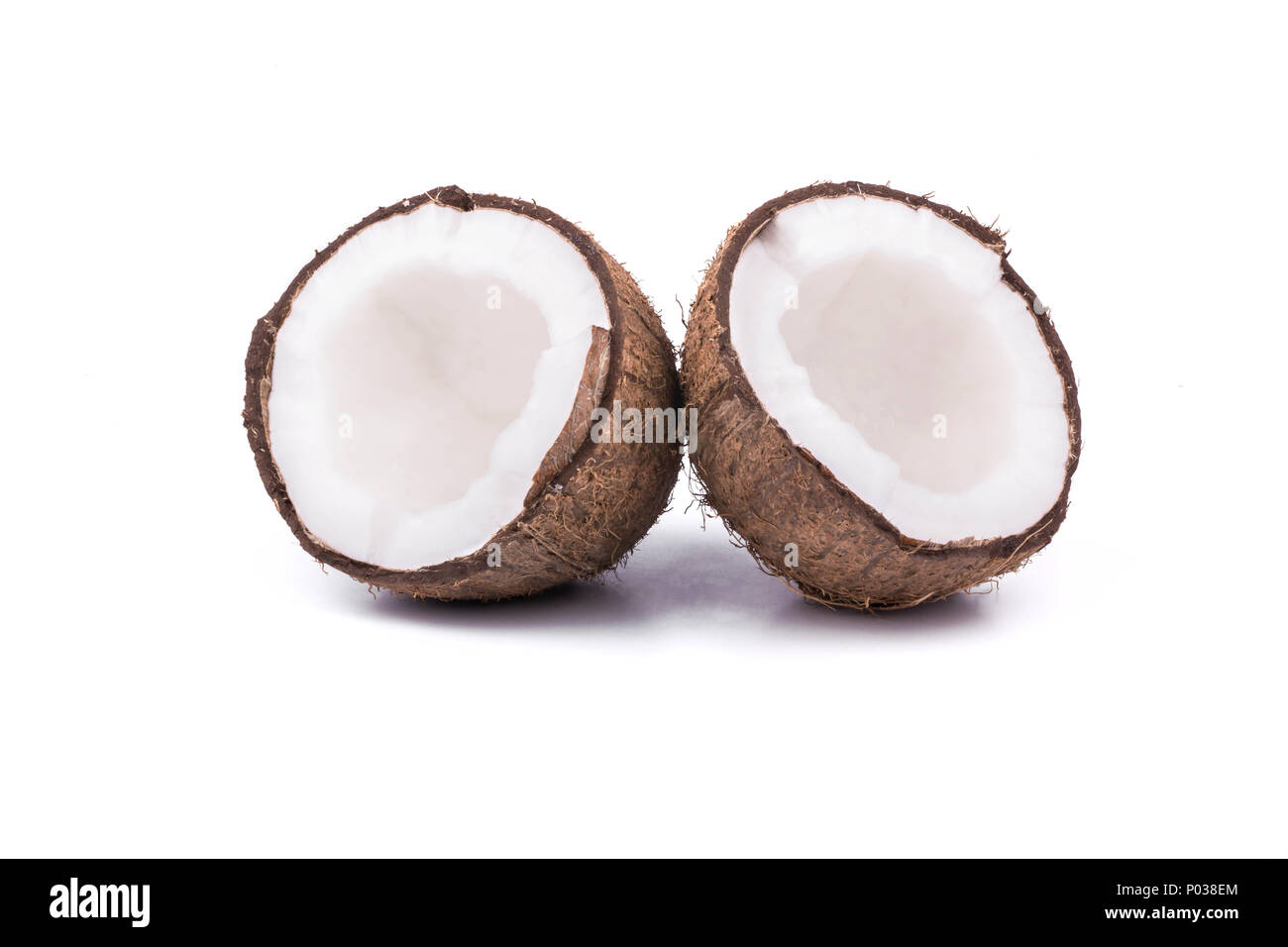 Ripe fruit coconut split into two halves on a white background Stock ...