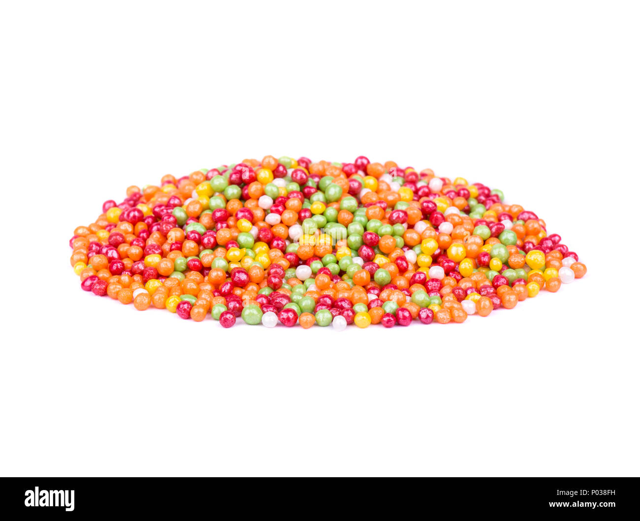 A pile of multicolored little candies on a white background Stock Photo ...