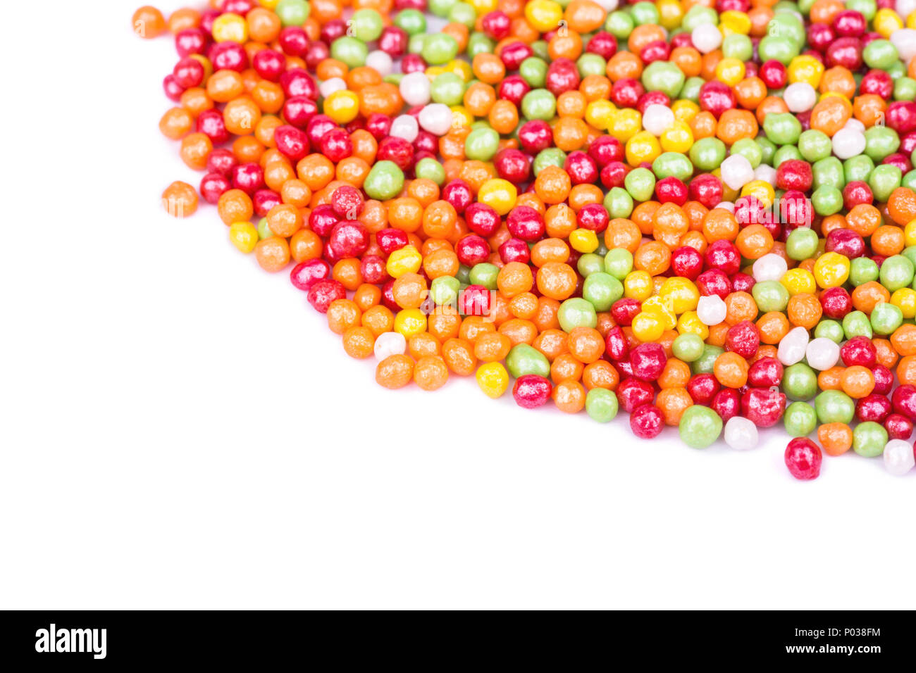 Scattered multicolored small round candies on white Stock Photo - Alamy