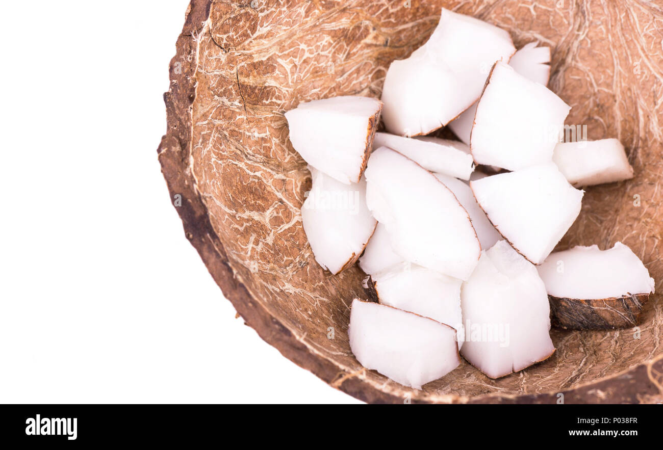 In the shell of coconut pulp is sliced nut closeup Stock Photo - Alamy