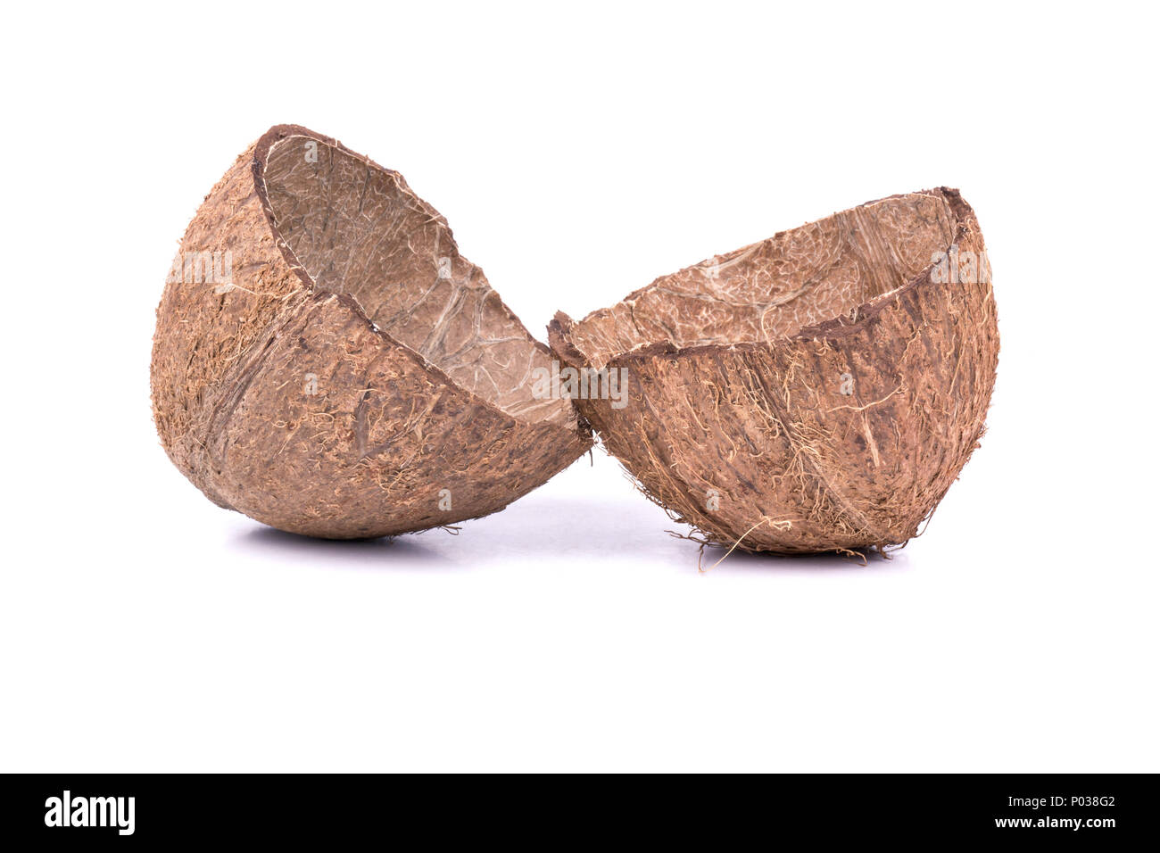 Two halves of a coconut shell fruit on a white background Stock Photo ...