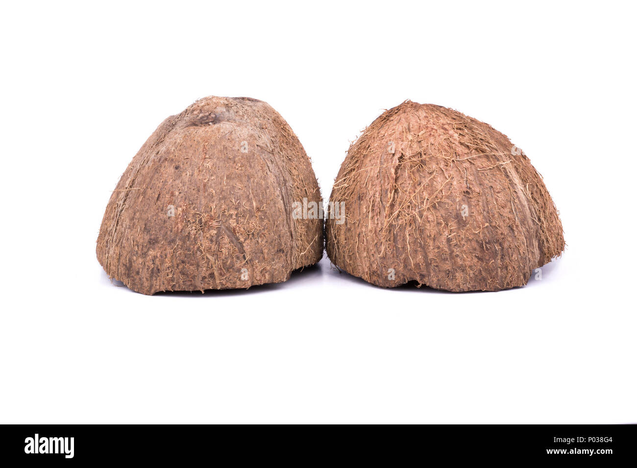 Two halves of a coconut shell fruit on a white background Stock Photo ...