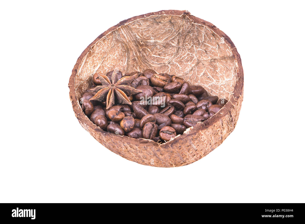 Roasted coffee beans in coconut shell on a white background Stock Photo ...